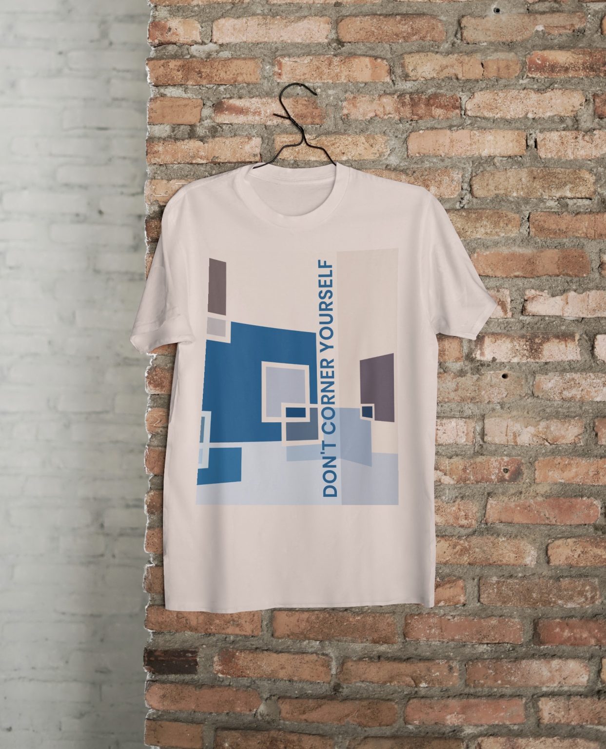 Shirt Mockup Hanging on a Brick Wall | Mediamodifier