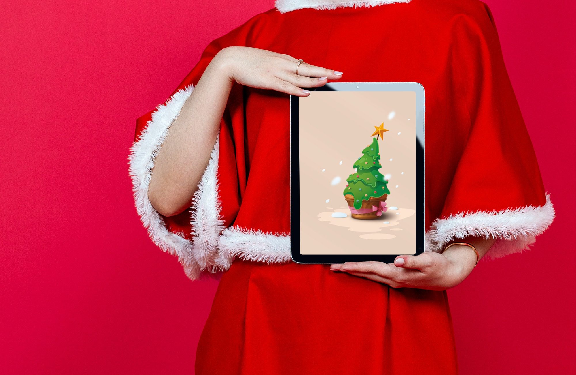 Photoshop Mockup of a Tablet Held by a Woman at Christmas | Mediamodifier