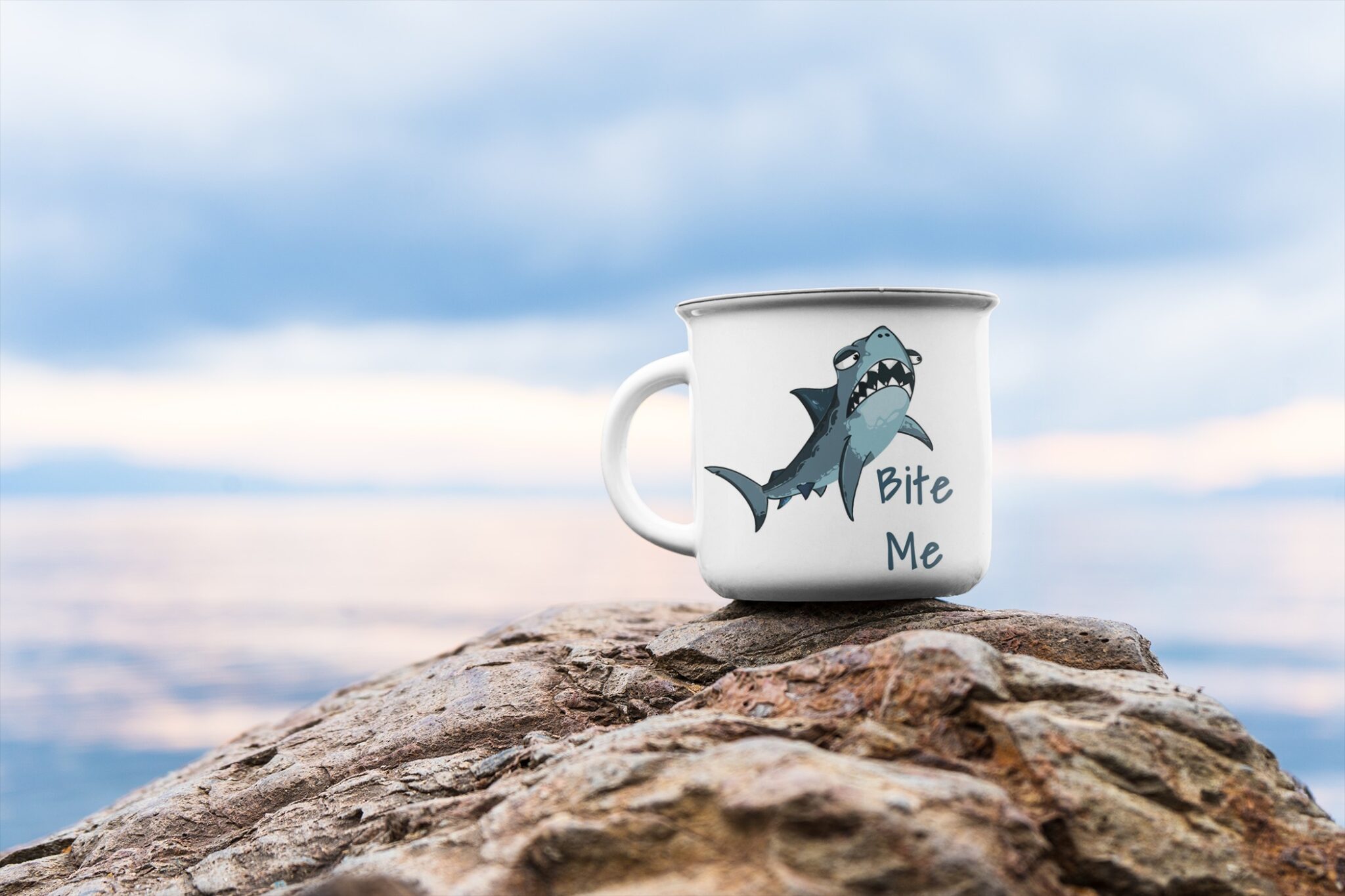 Funny Bite Me Design in Old Mug beside Sea | Mediamodifier