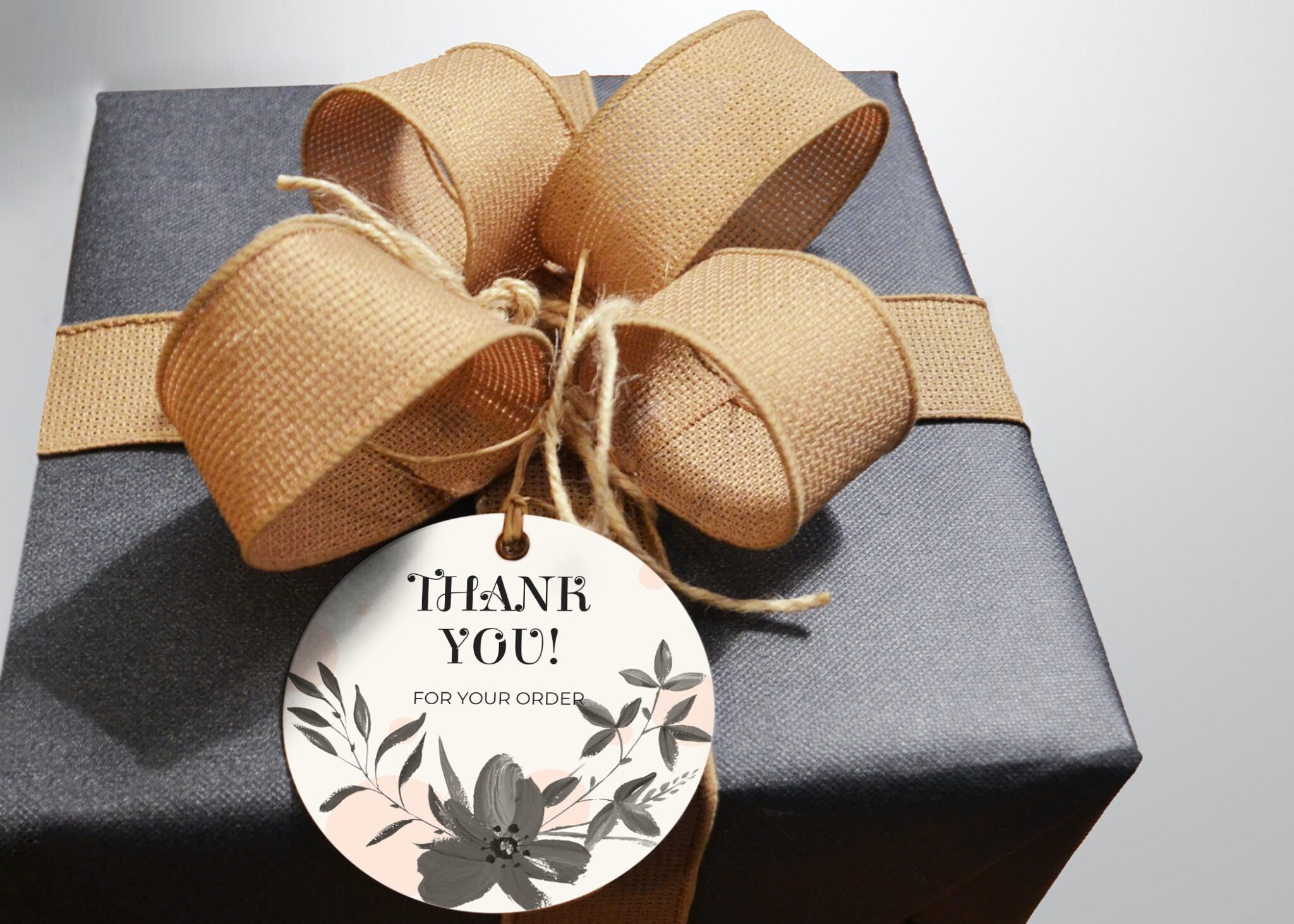 Round Gift Tag Design in Gift Box with Black Wrapping Paper | Mediamodifier