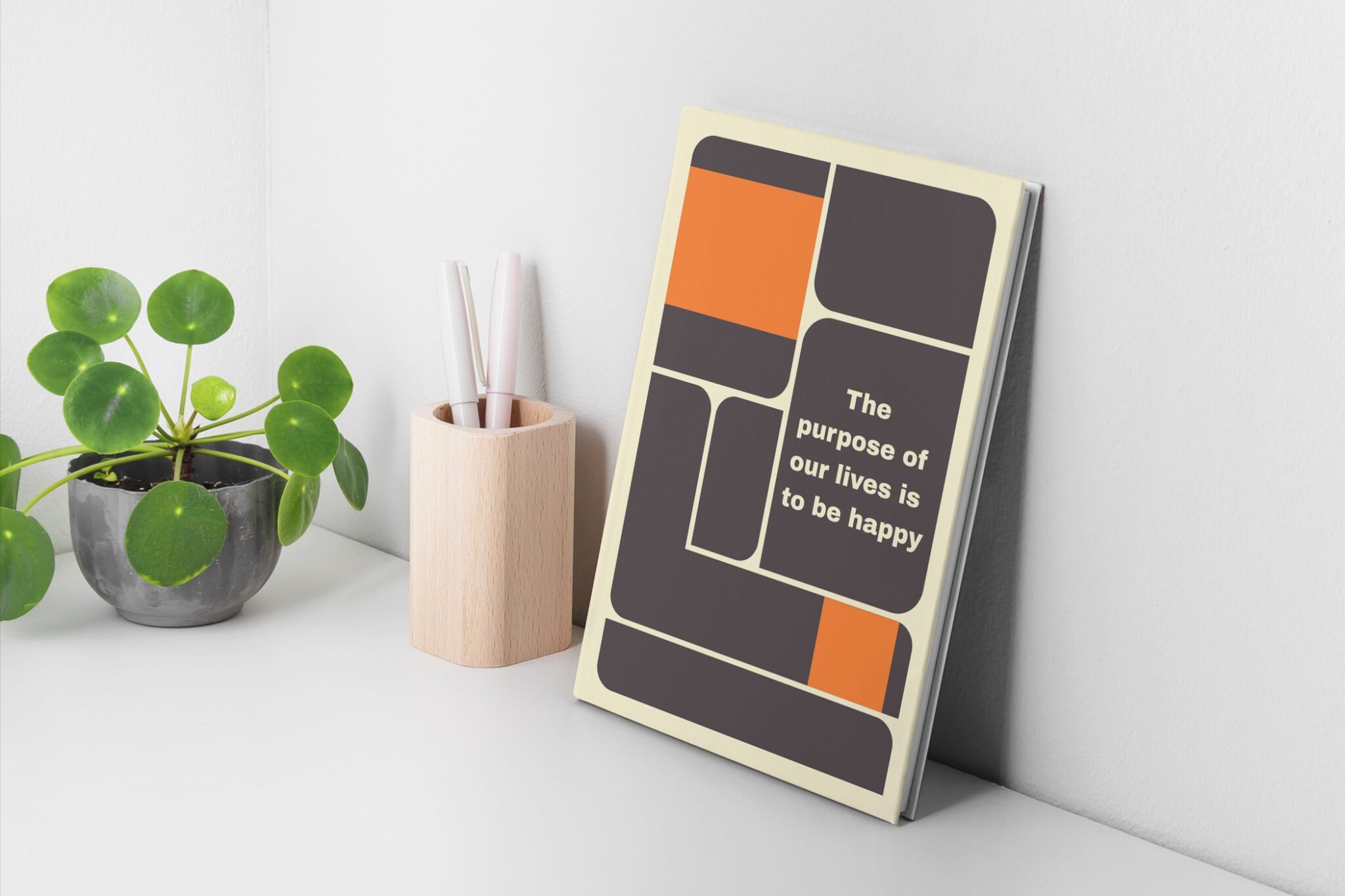 Book Cover Design on Hardcover Book Leaning on a Wall Mockup ...
